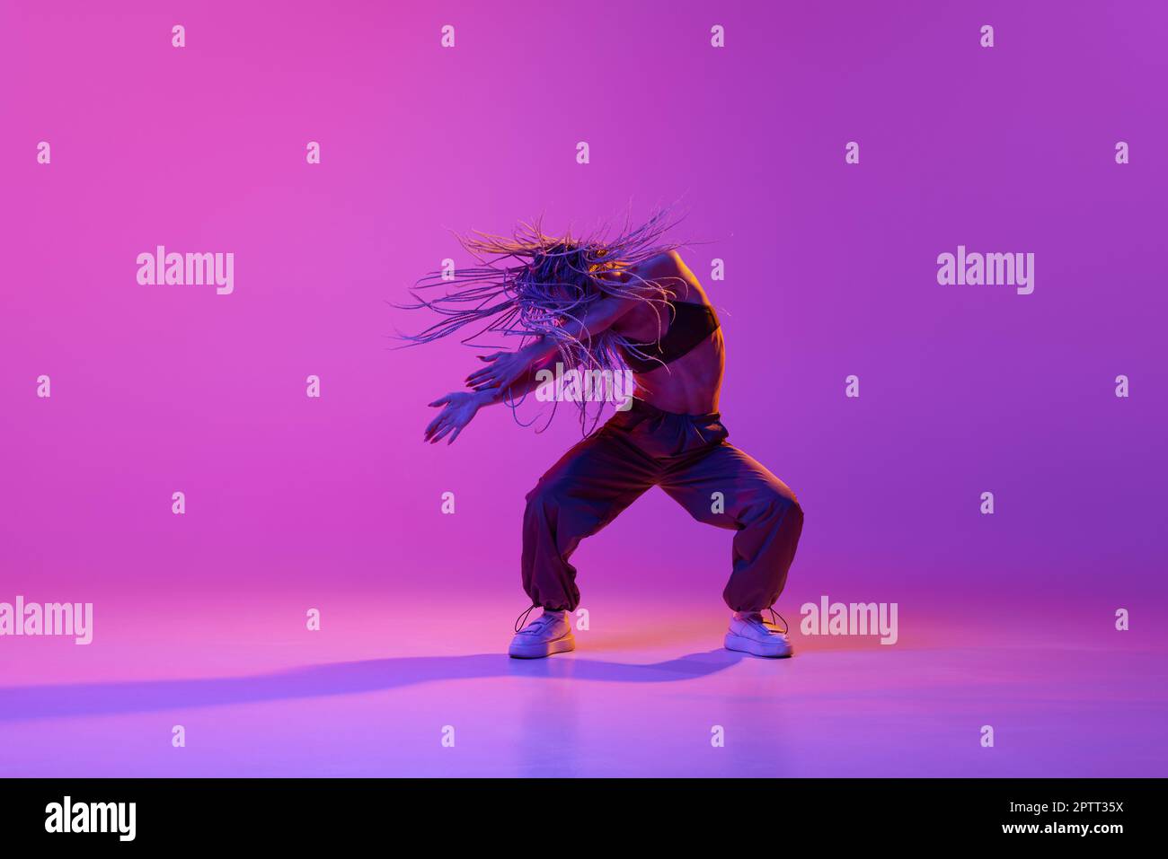 Portrait with one young girl, inspired dancer with pigtails dancing ...