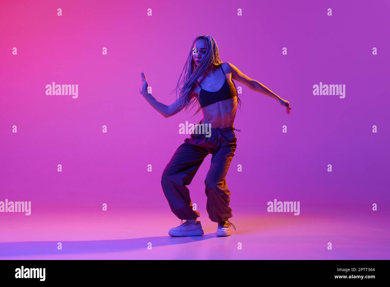 Young girl wearing street style clothes dancing with emotions over ...