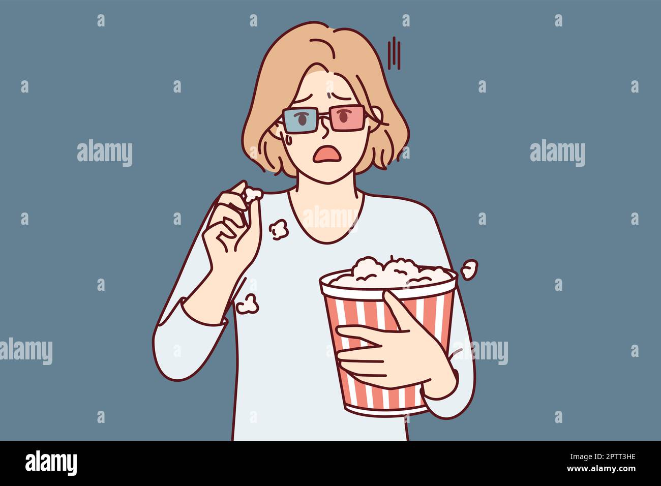 Frightened woman with bucket popcorn opens mouth during scary moment in ...