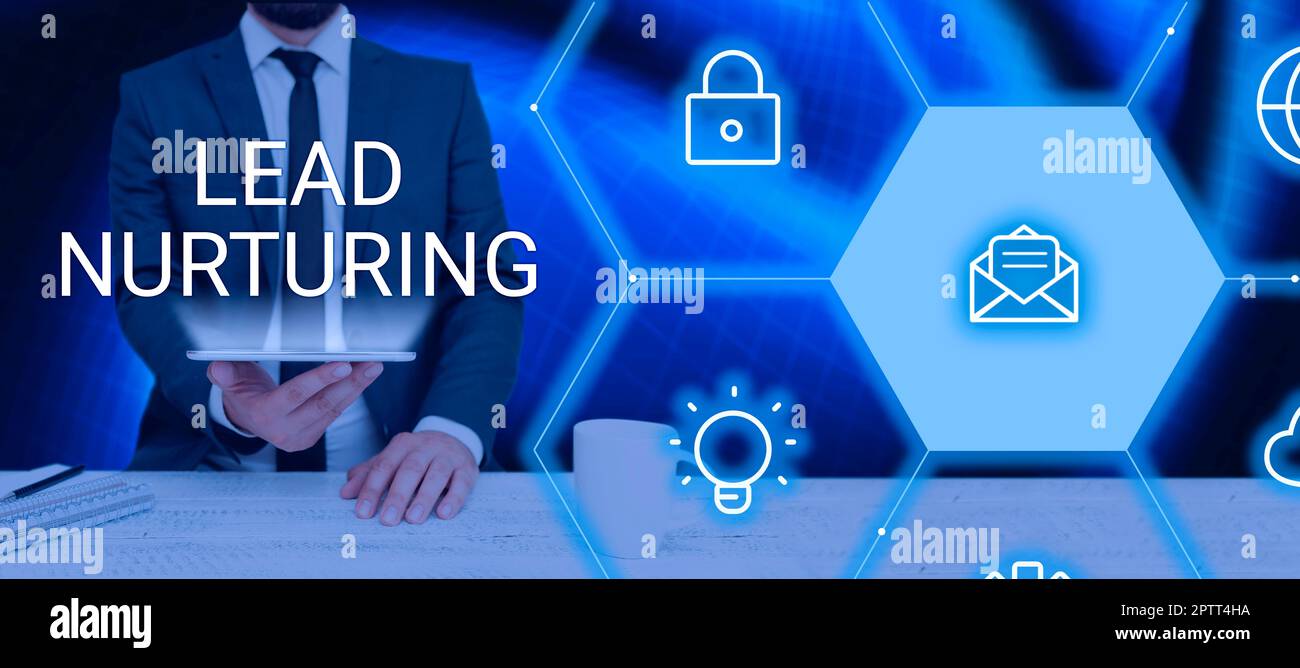 Hand writing sign Lead Nurturing, Word Written on method of building a ...