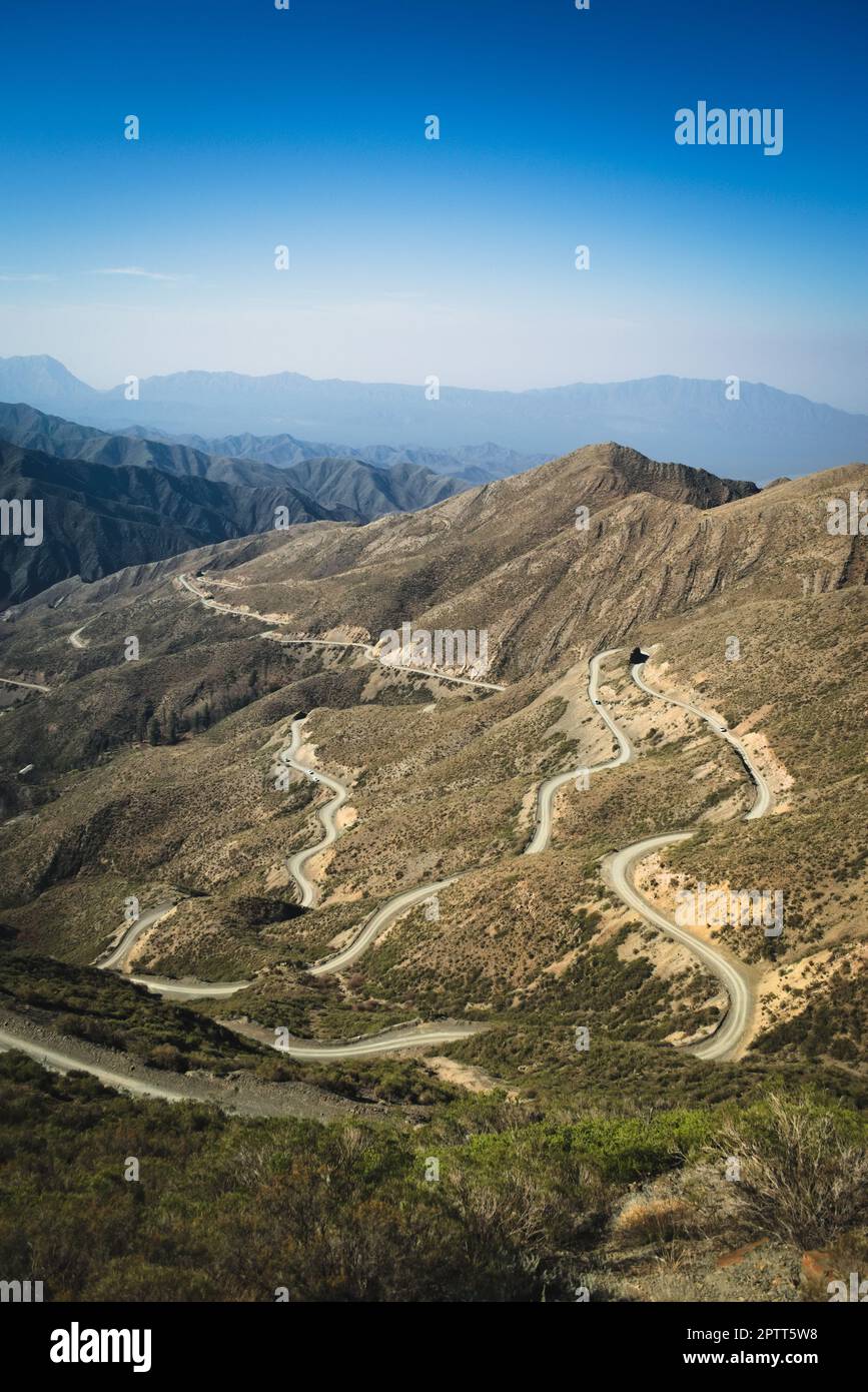 Narrow twisting dirt road across the Andes Mountains in Mendoza ...