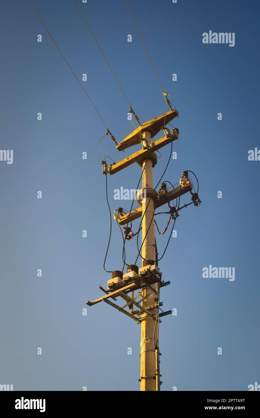 Electrical pylon and power lines against blue sky. Infrastructure ...