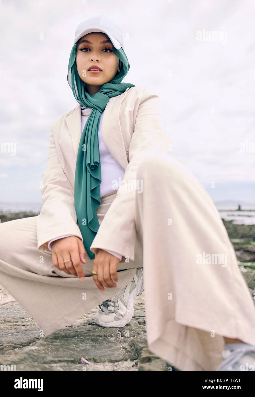 Beautiful young arab woman posing outdoors in a headscarf. Attractive ...