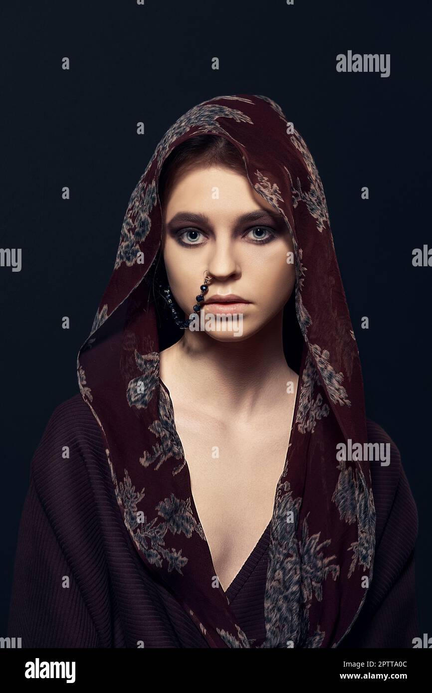 Low key portrait of a girl in bathrobe with hood Stock Photo - Alamy