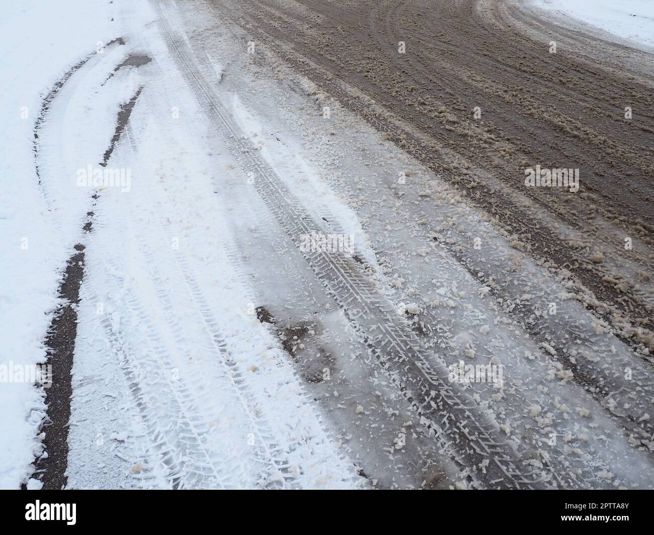 A fork or siding from a roundabout. Snowdrifts on the side of the road ...