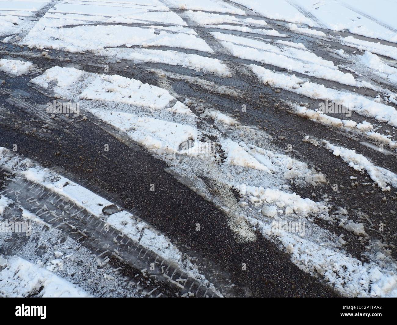 A fork or siding from a roundabout. Snowdrifts on the side of the road ...