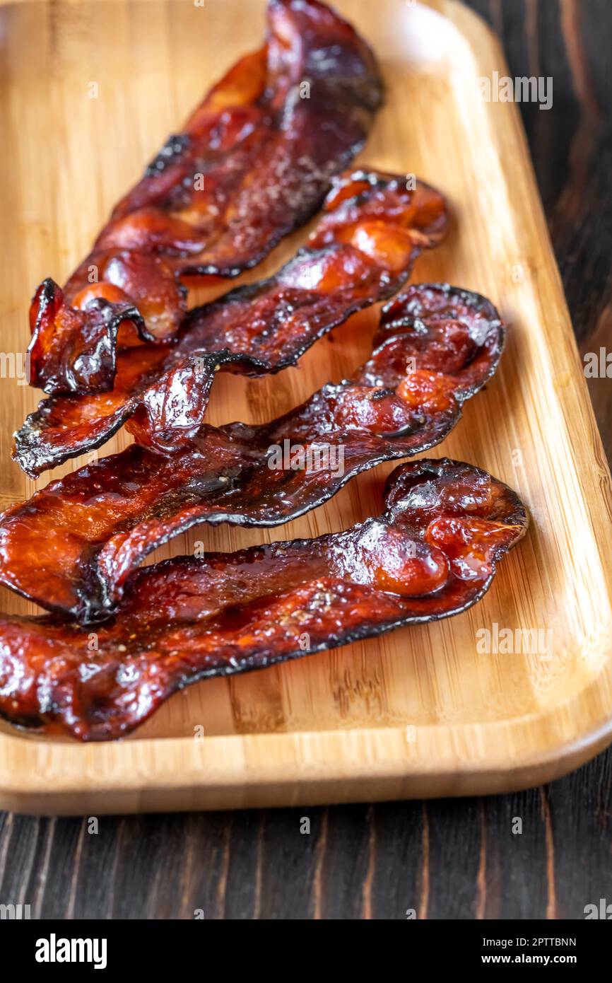 Fried bacon strips glazed in brown sugar Stock Photo - Alamy