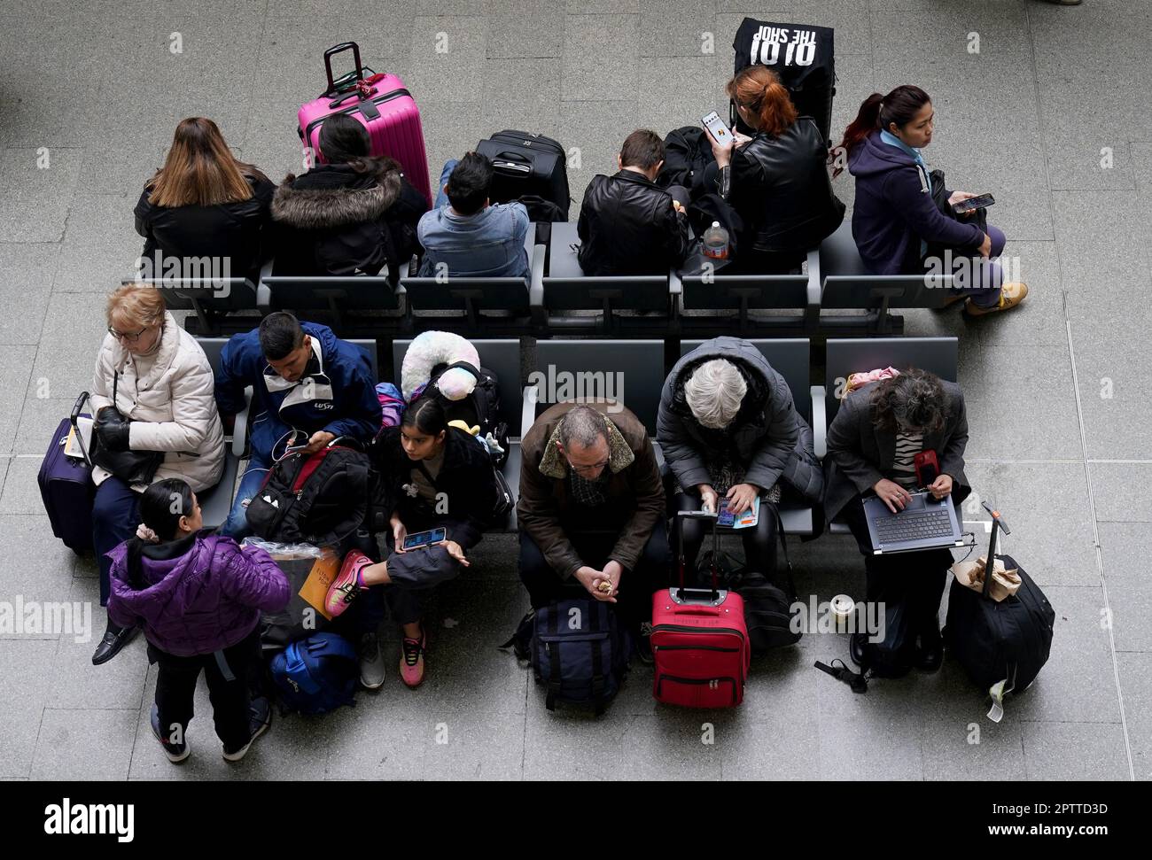 Passengers wait to board trains at St. Pancras International station in ...