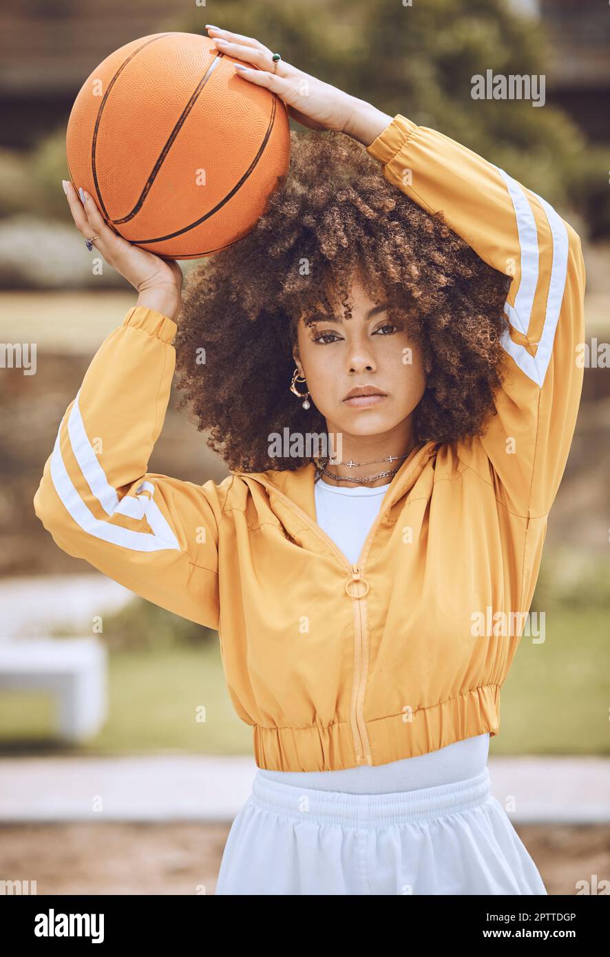 Mixed race woman posing on a basketball court. Beautiful basketball ...