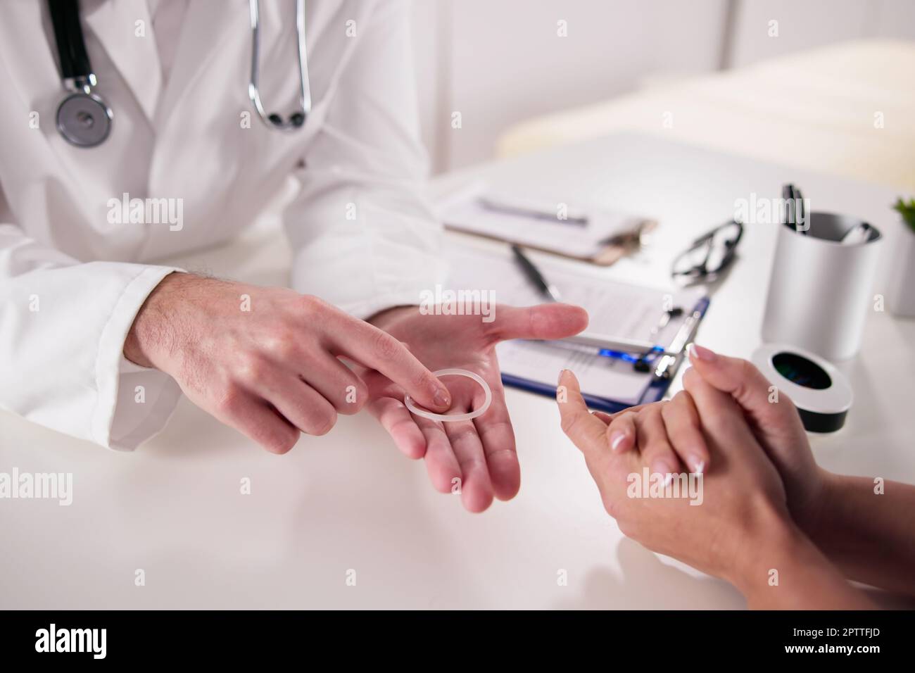 Gynecologist Showing Contraception Ring To Woman And Explaining Birth ...