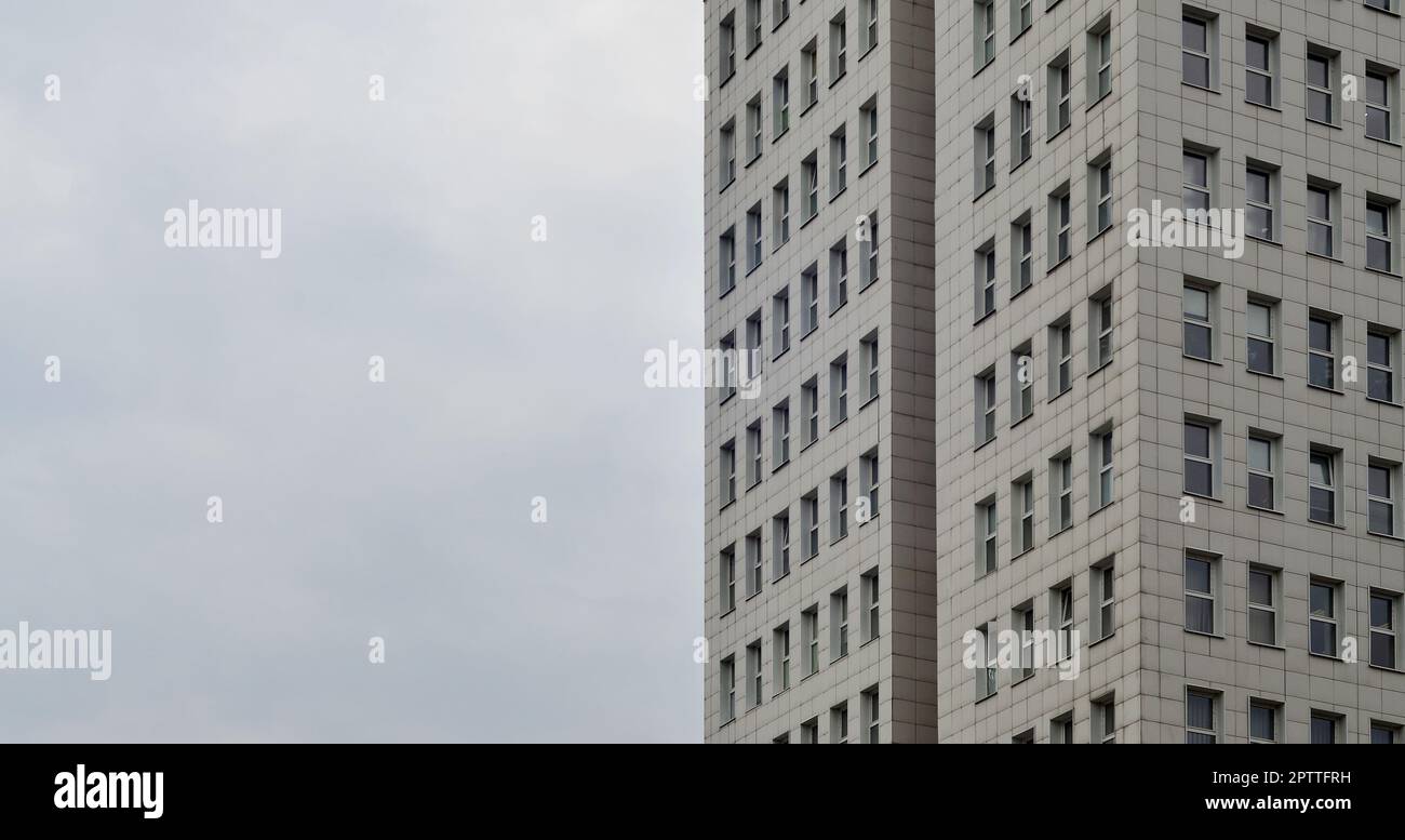 Multi-story office building beige color with lots of glass windows on a ...