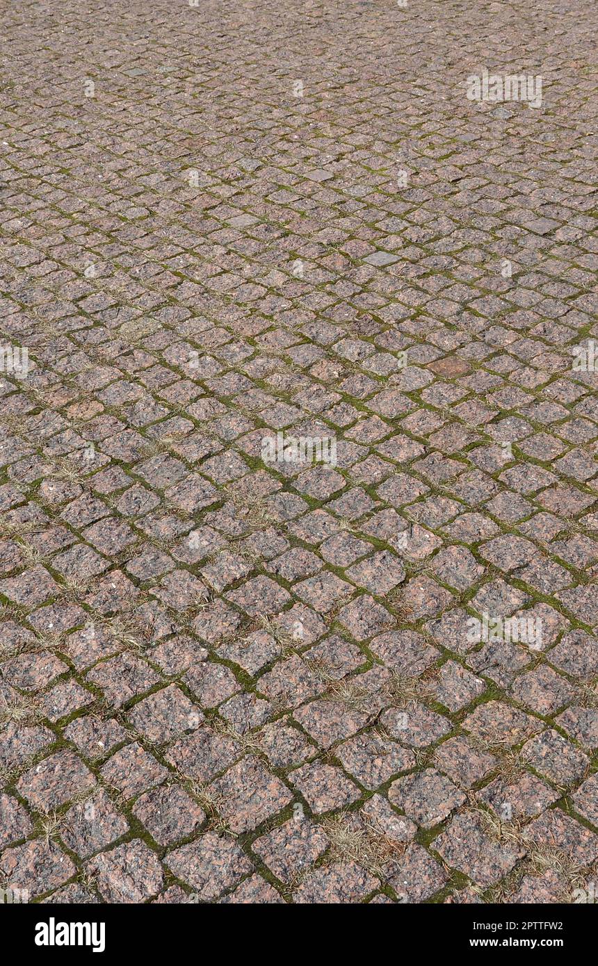 A large area, laid out of paving stone in perspective. Detailed photo ...