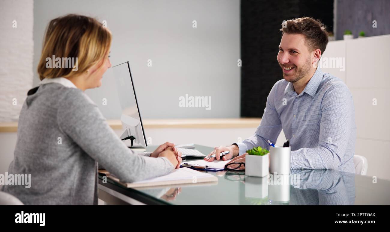 Two People Interview Meeting In Office. Hire Employee Stock Photo - Alamy