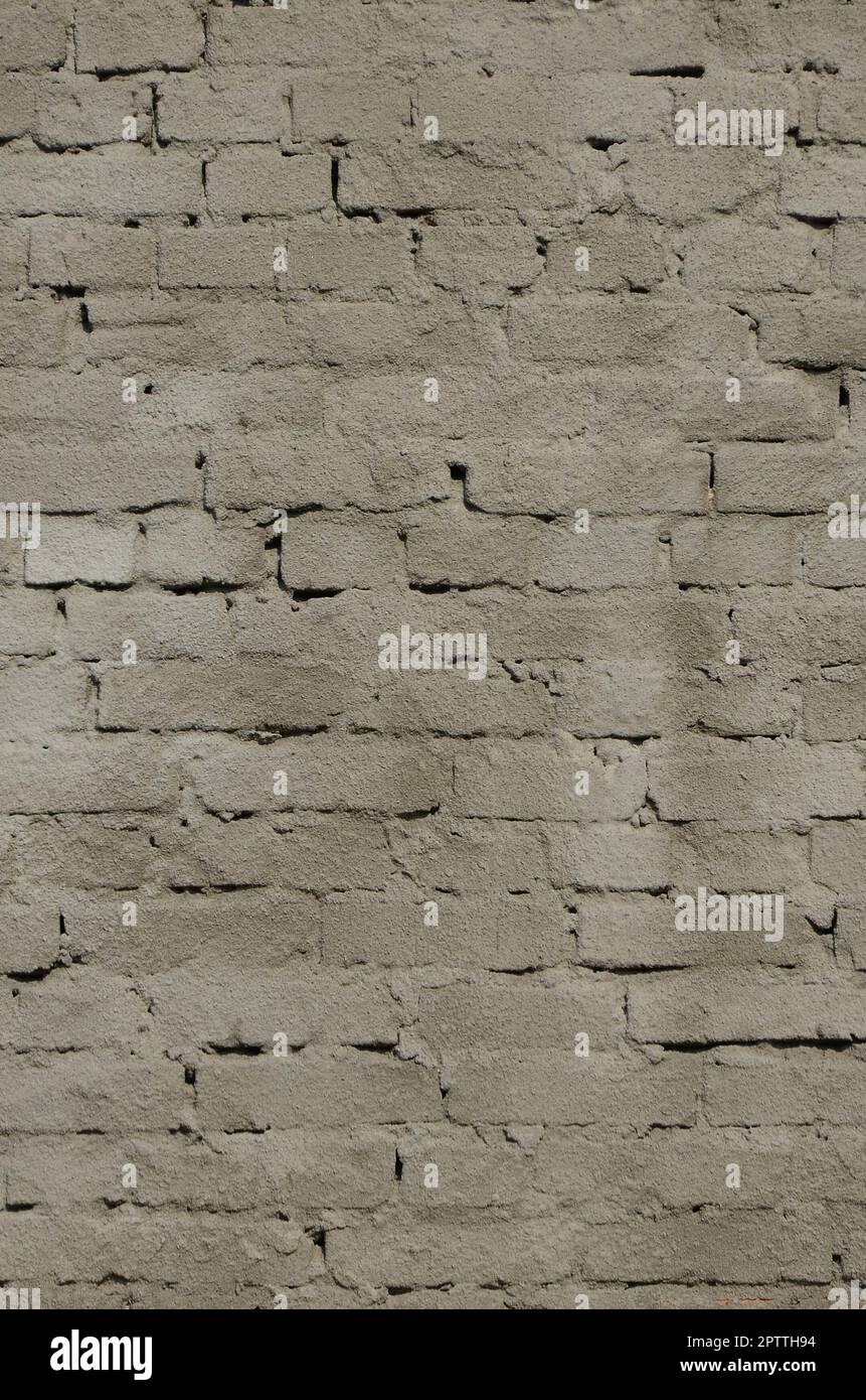 The texture of the old brick wall, painted in gray. Background image of ...