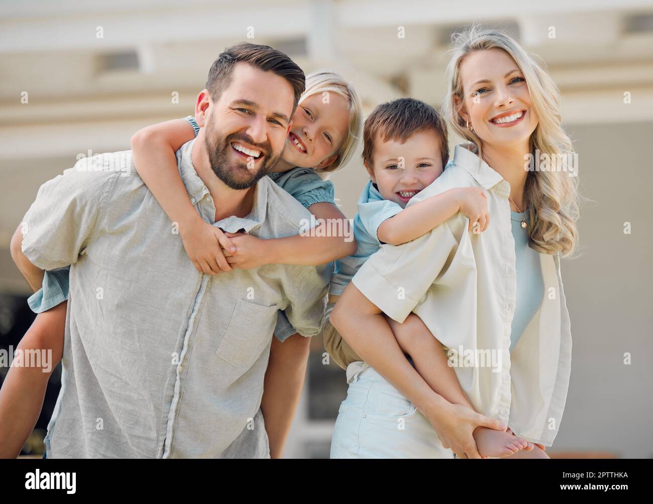 Happy parents carrying kids park hi-res stock photography and images ...