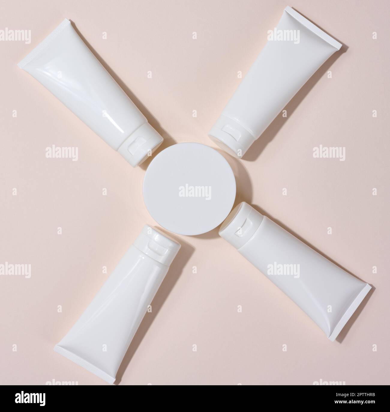 White plastic tubes, jars and other form of packaging for cosmetics on ...