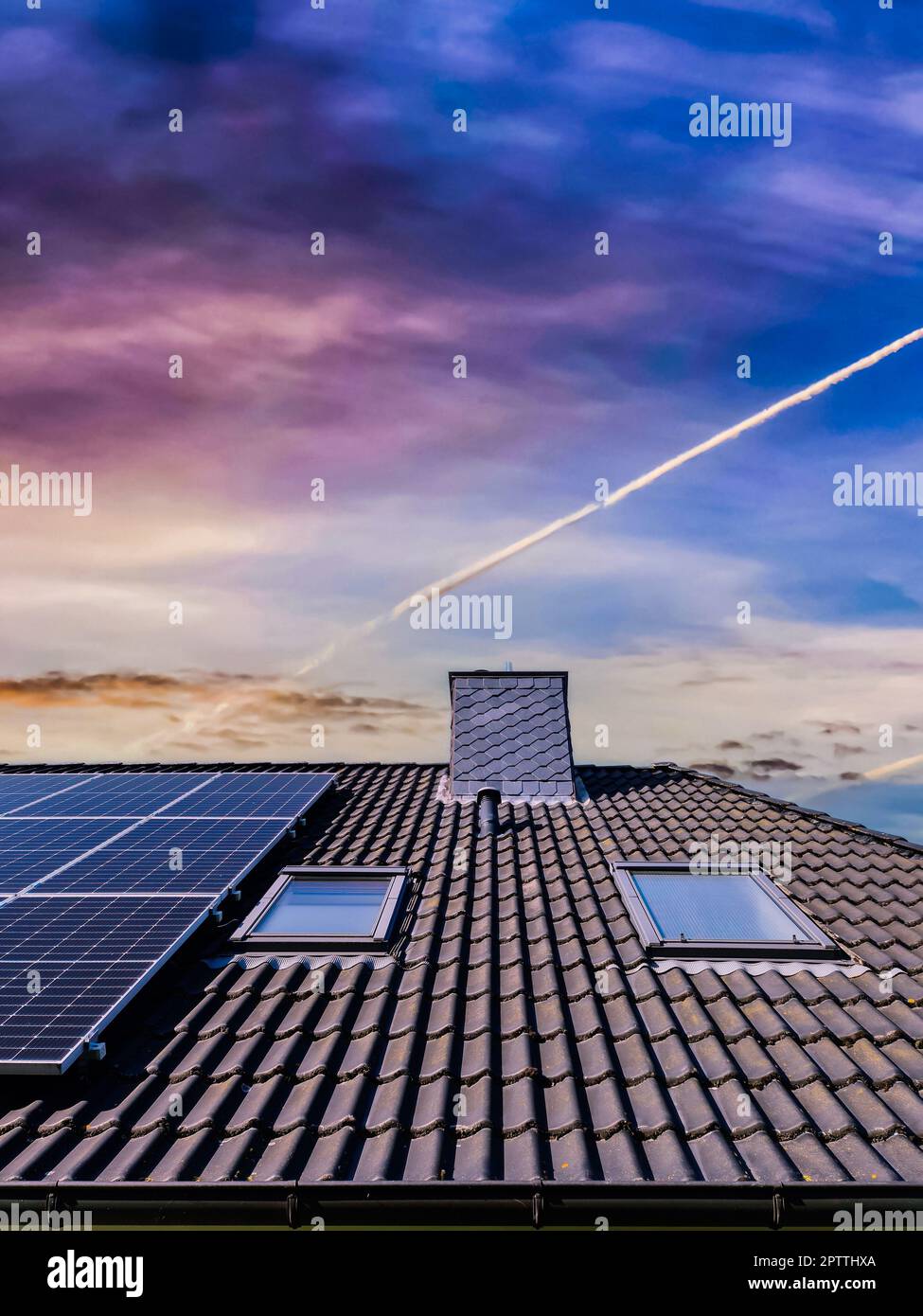Solar panels producing clean energy on a roof of a residential house ...