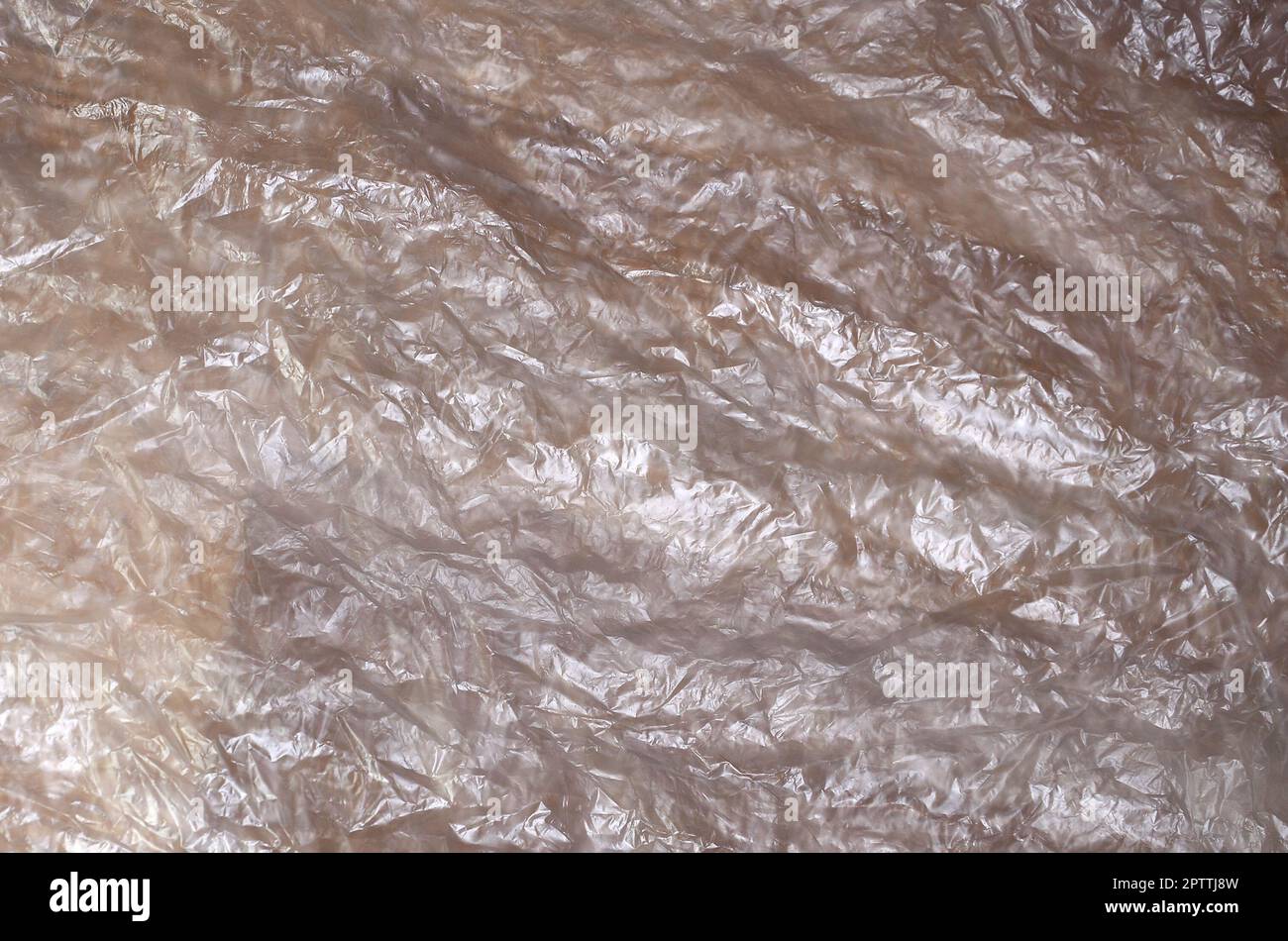 Texture of white crumpled cellophane surface transparent on sunlight ...