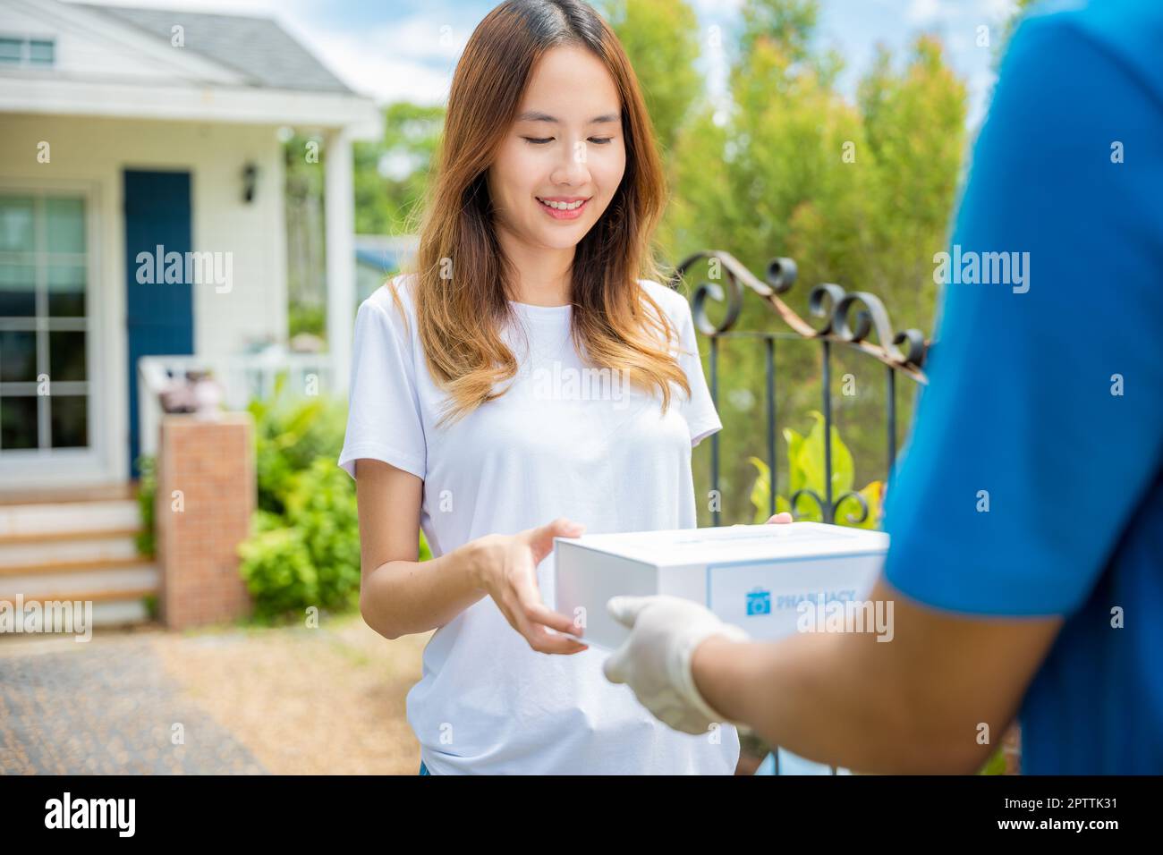 Delivery man give medicine drug to patient female at home, Sick Asian ...