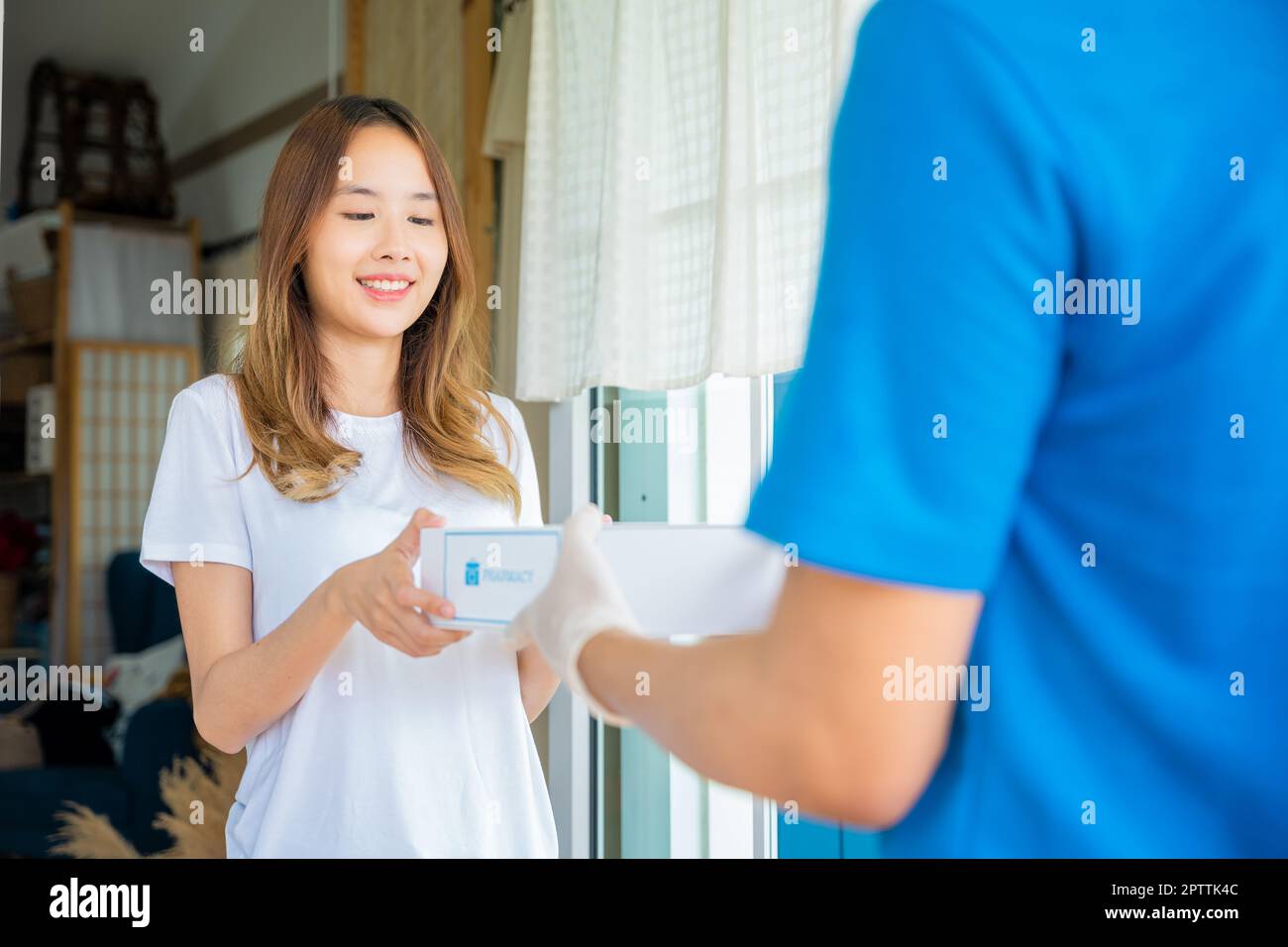 Sick Asian young woman receive medicine first aid pharmacy box from ...
