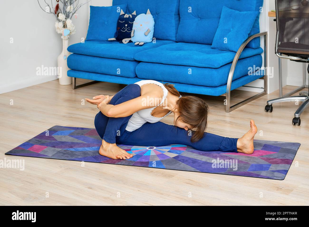 Full length portrait of young woman doing yoga pose dedicated to the ...