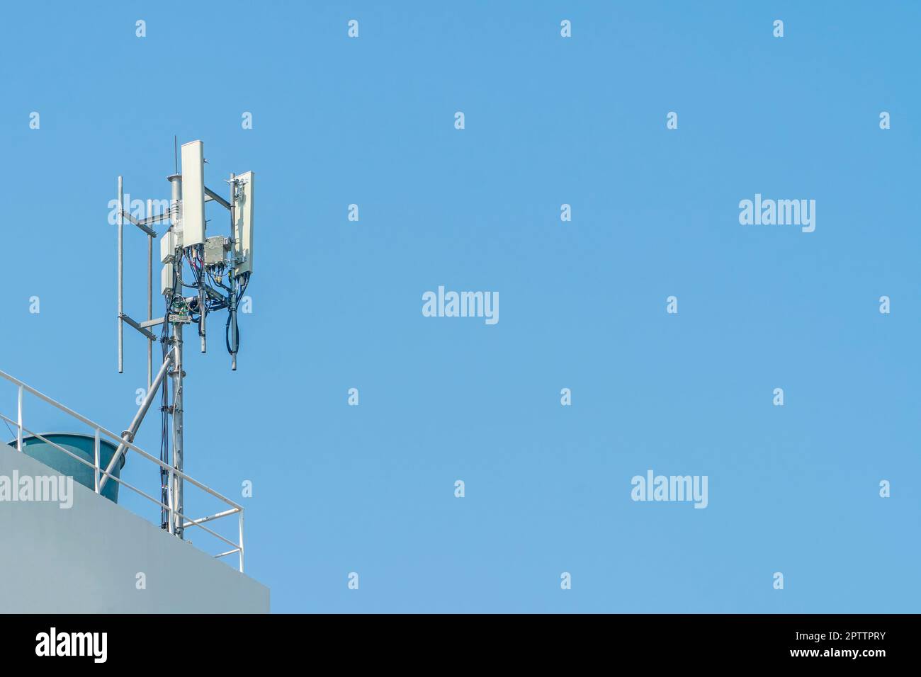 Cellular phone towers are on the rooftop of the building Stock Photo ...