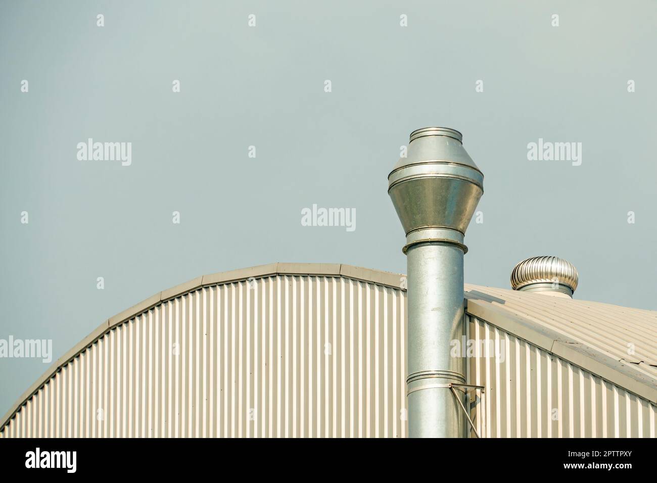 Several white ventilation vents are located near building Stock Photo ...