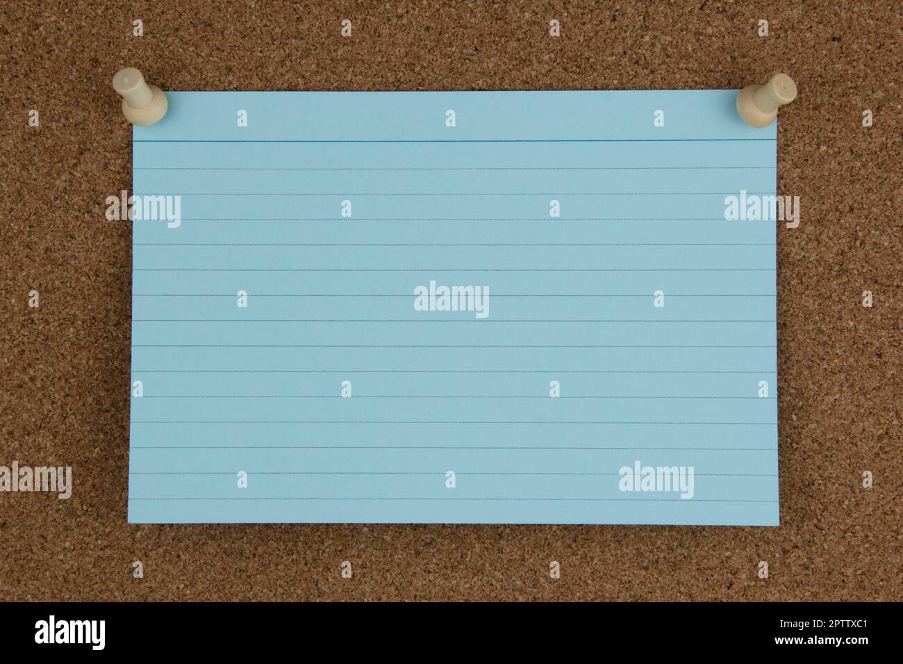 Cork board with tacks, blue flash card Stock Photo - Alamy