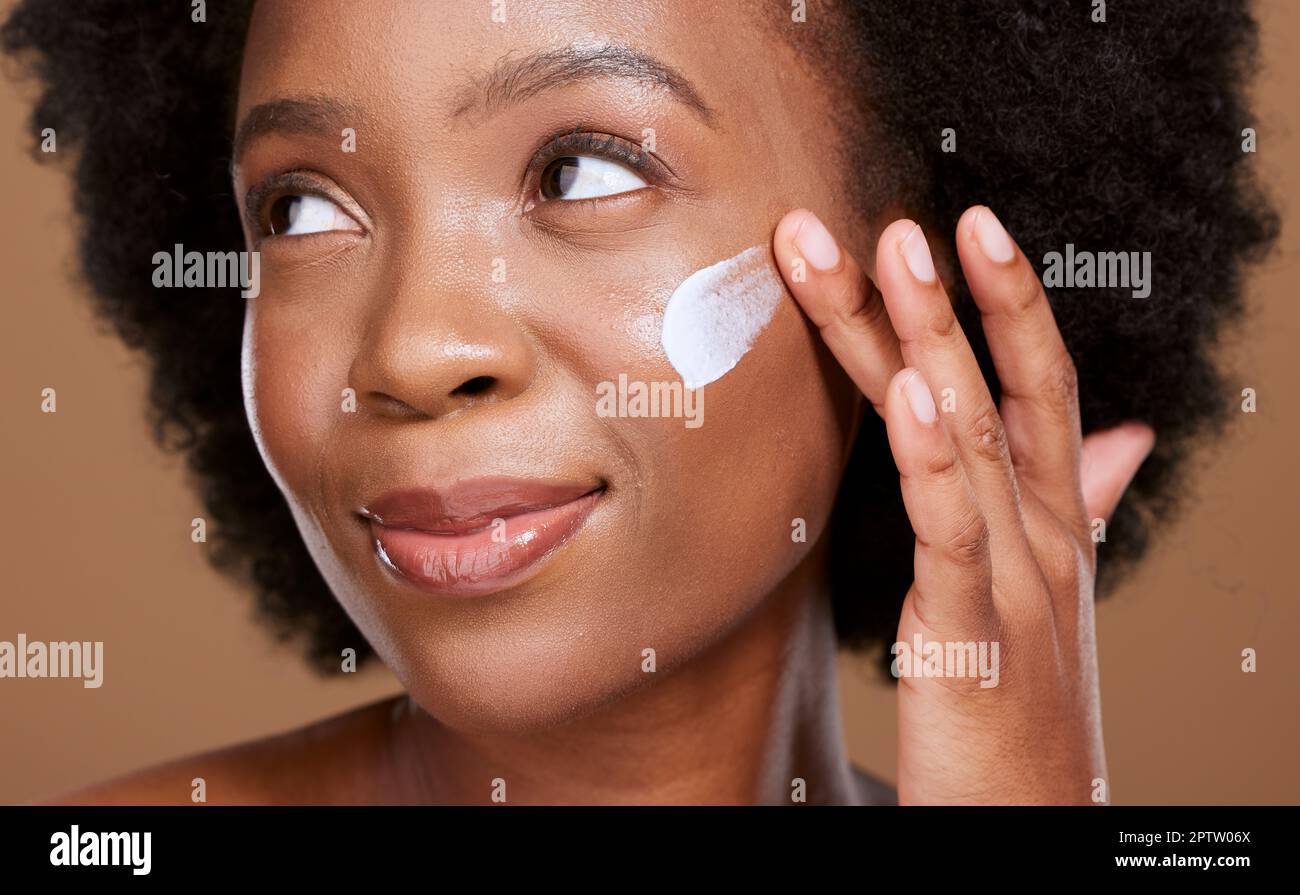 Black woman, face cream and beauty, sunscreen makeup product and luxury ...