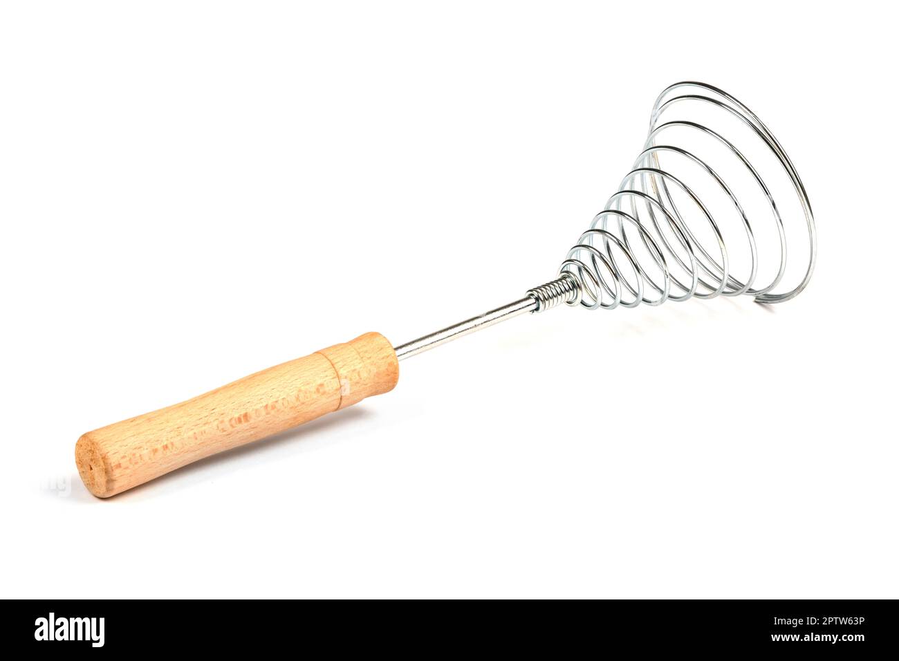 Close-up of old retro whisk kitchen tool on white background. Side view ...