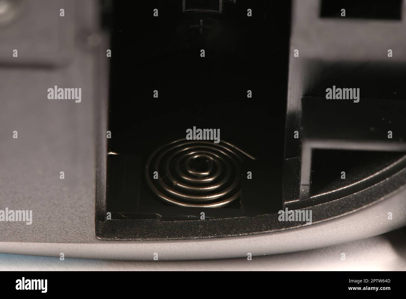 Power supply compartment for a wireless computer mouse. Extrem close-up ...
