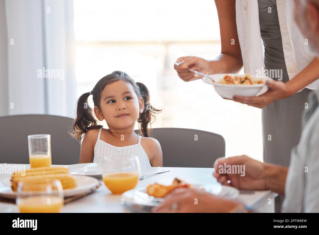 Woman giving food to child hi-res stock photography and images - Alamy