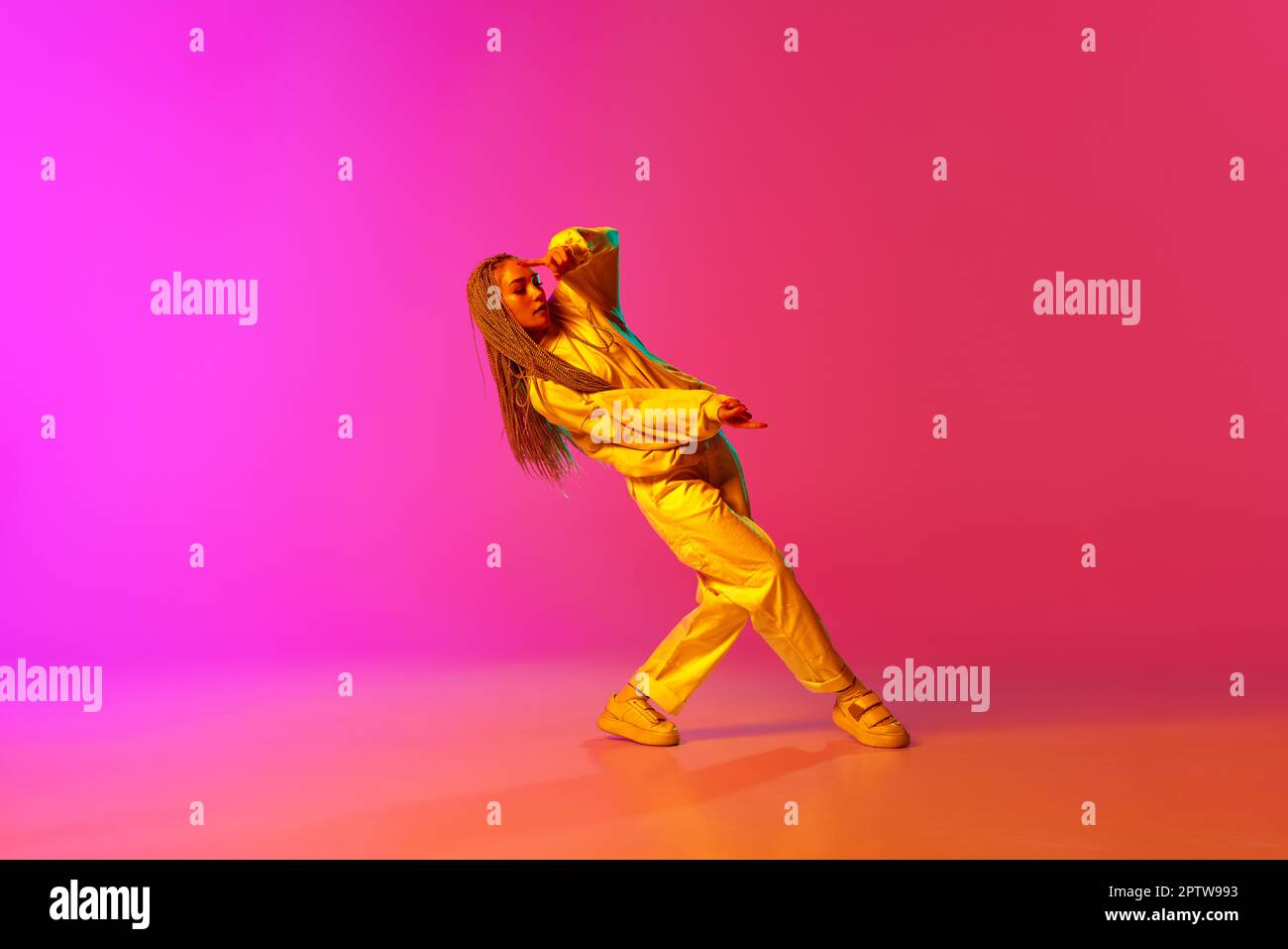 Portrait with professional dancer with dreadlocks wearing hip-hop ...