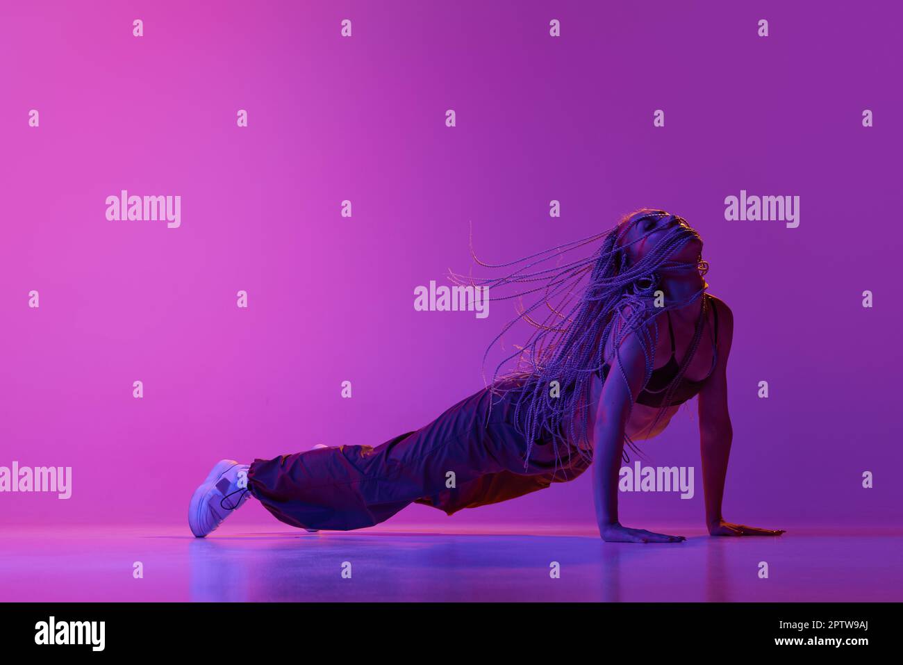 Attractive woman,young dancer with dreadlocks wearing black casual ...