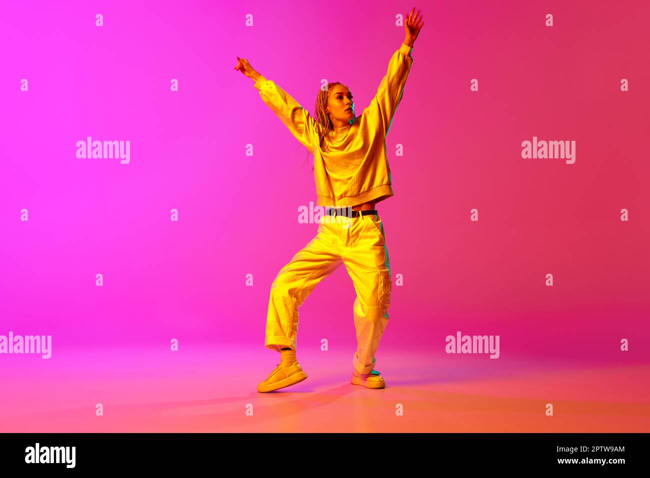Portrait with one young girl, dancer with dreadlocks dancing with hands ...