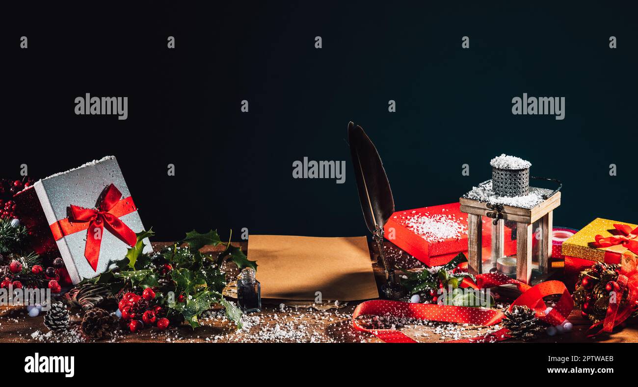 Table with presents and a blank letter to santa claus Stock Photo - Alamy