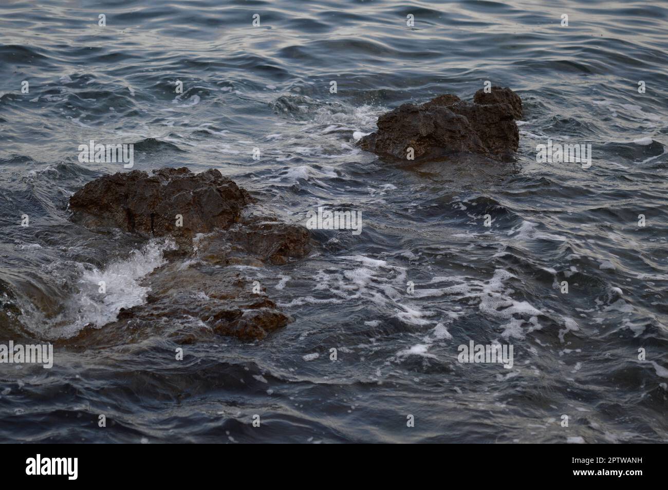 Sea waves crashing into rocks.Sea waves crashing into rocks. Storm at ...
