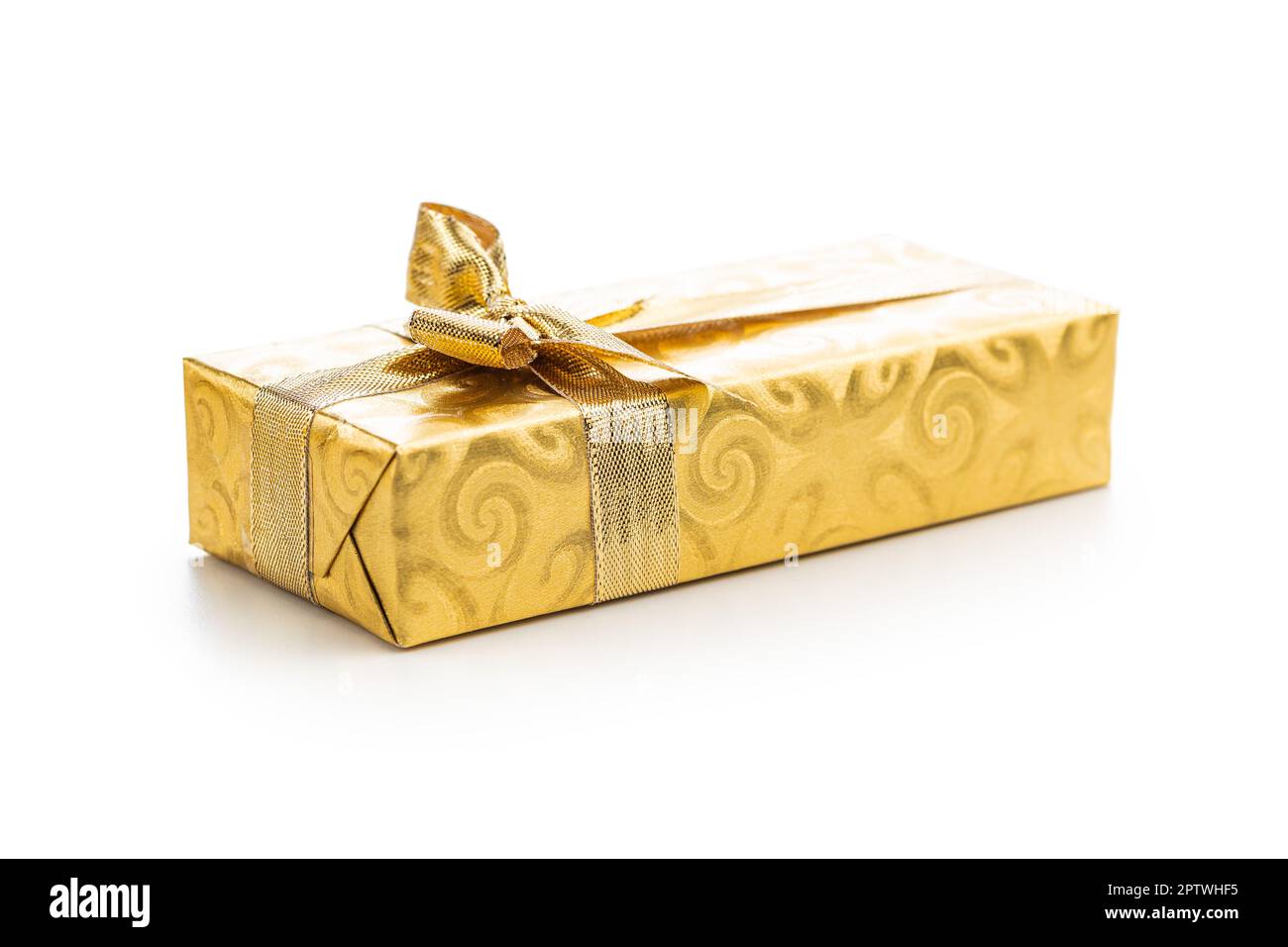 Gift wrapped in gold foil. Christmas present with gold ribbon isolated ...