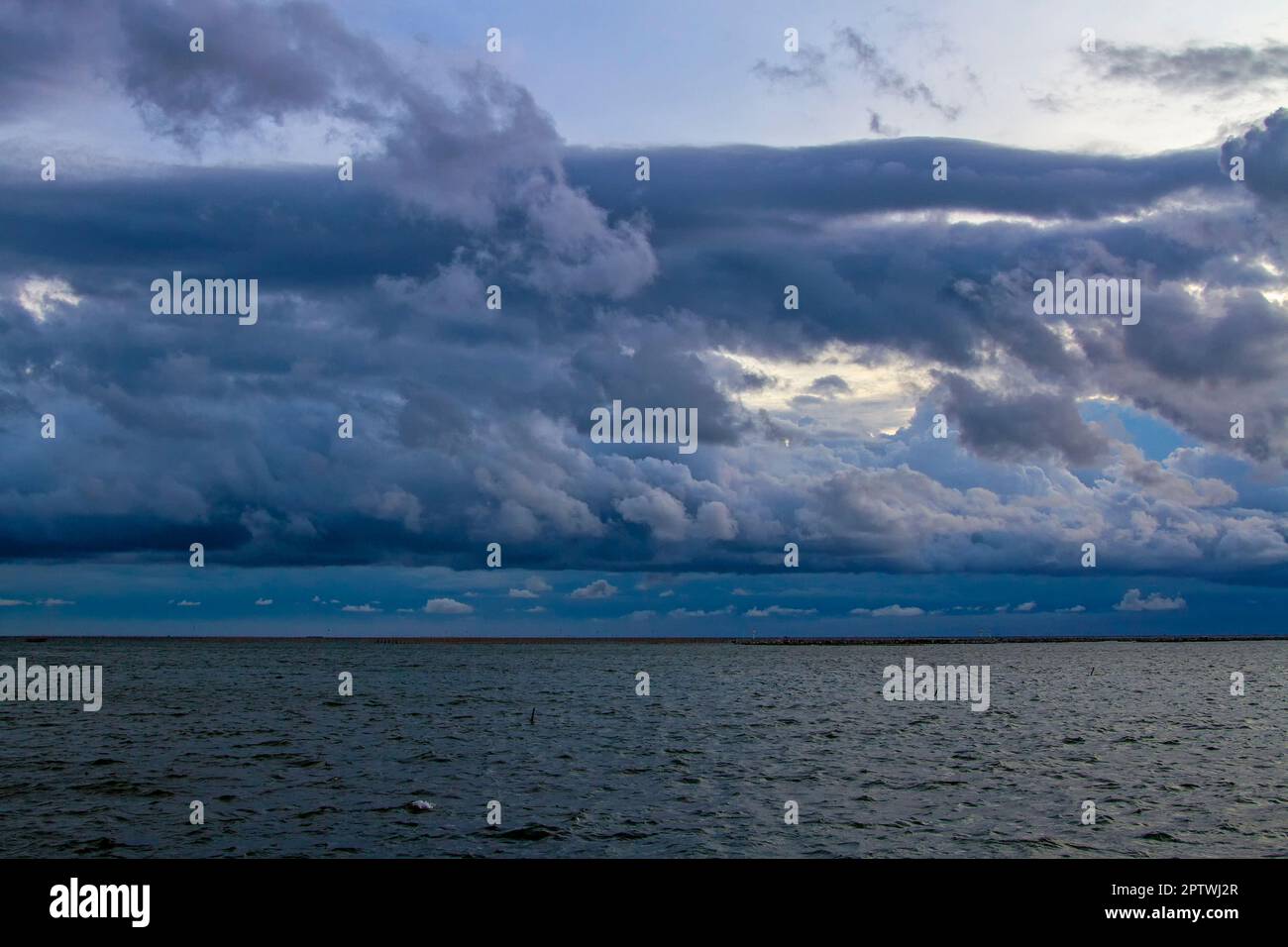 Storm at sea rain or clouds on sky Stock Photo - Alamy