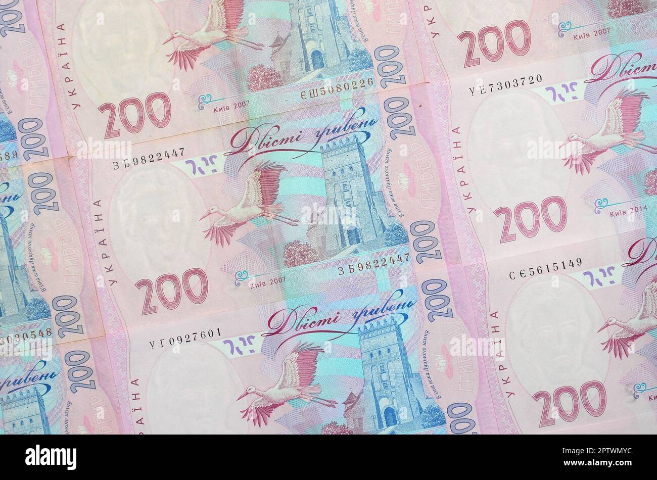 A close-up of a pattern of many Ukrainian currency banknotes with a par ...