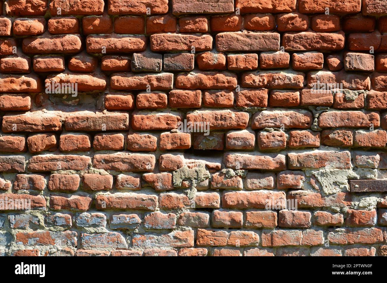 Horizontal wall texture of several rows of very old brickwork made of ...
