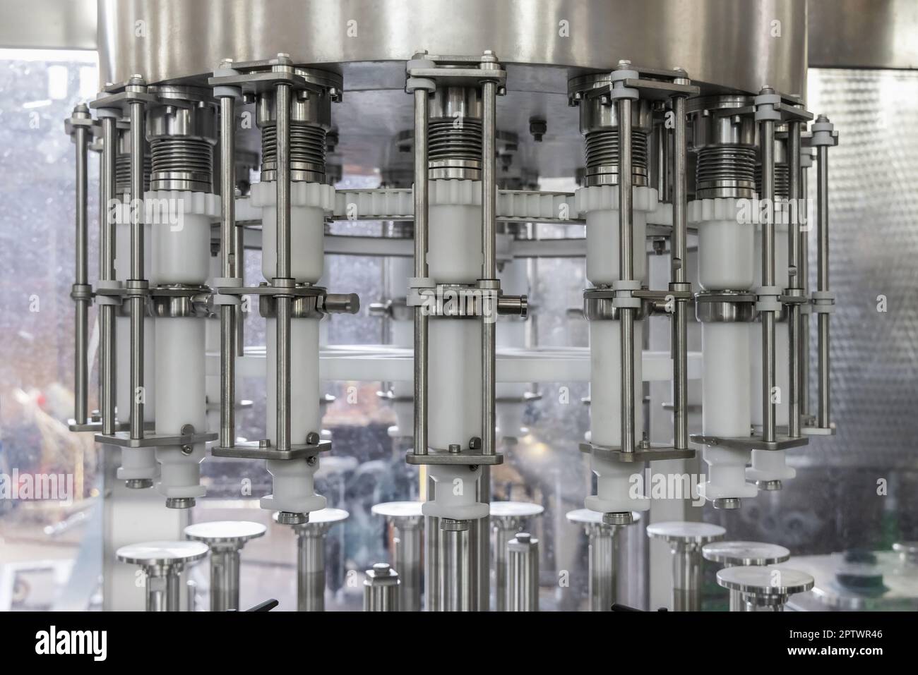 Industrial bottling machine at modern wine factory in Italy, close up ...