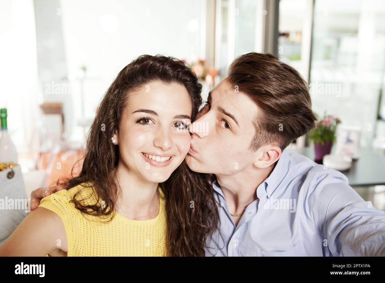 Young couple kissing in bar hi-res stock photography and images - Alamy