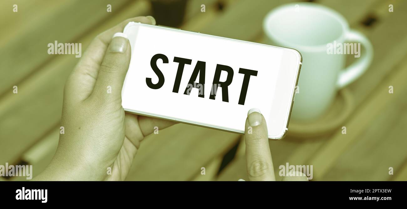 Hand writing sign Start, Concept meaning begin or be reckoned from ...