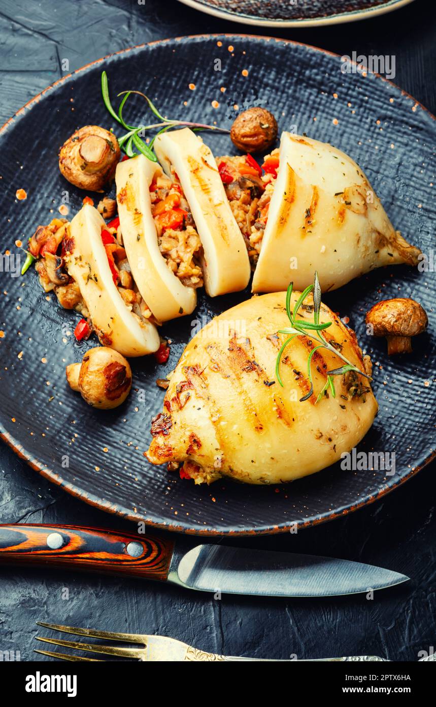 Tasty grilled squids with vegetable stuffing. Stuffed calamari Stock ...