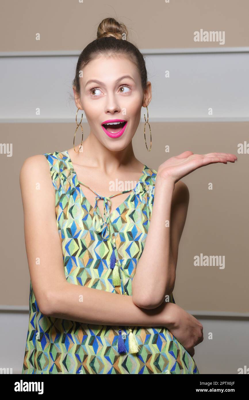 Tricky Girl Makes Faces Sticks Out Tongue Holds Copyspace On The Palm