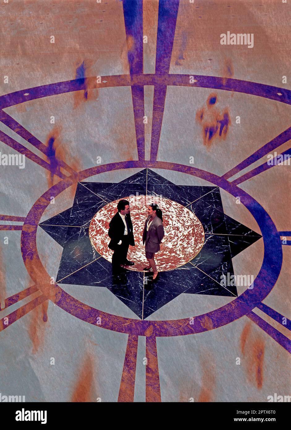 High viewpoint of young man & woman standing together in busy, indoor ...