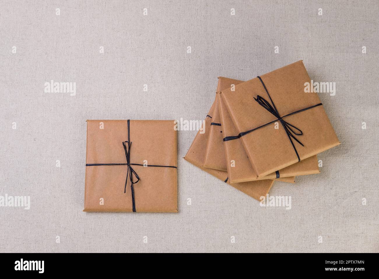 Gift box tied with band Stock Photo - Alamy