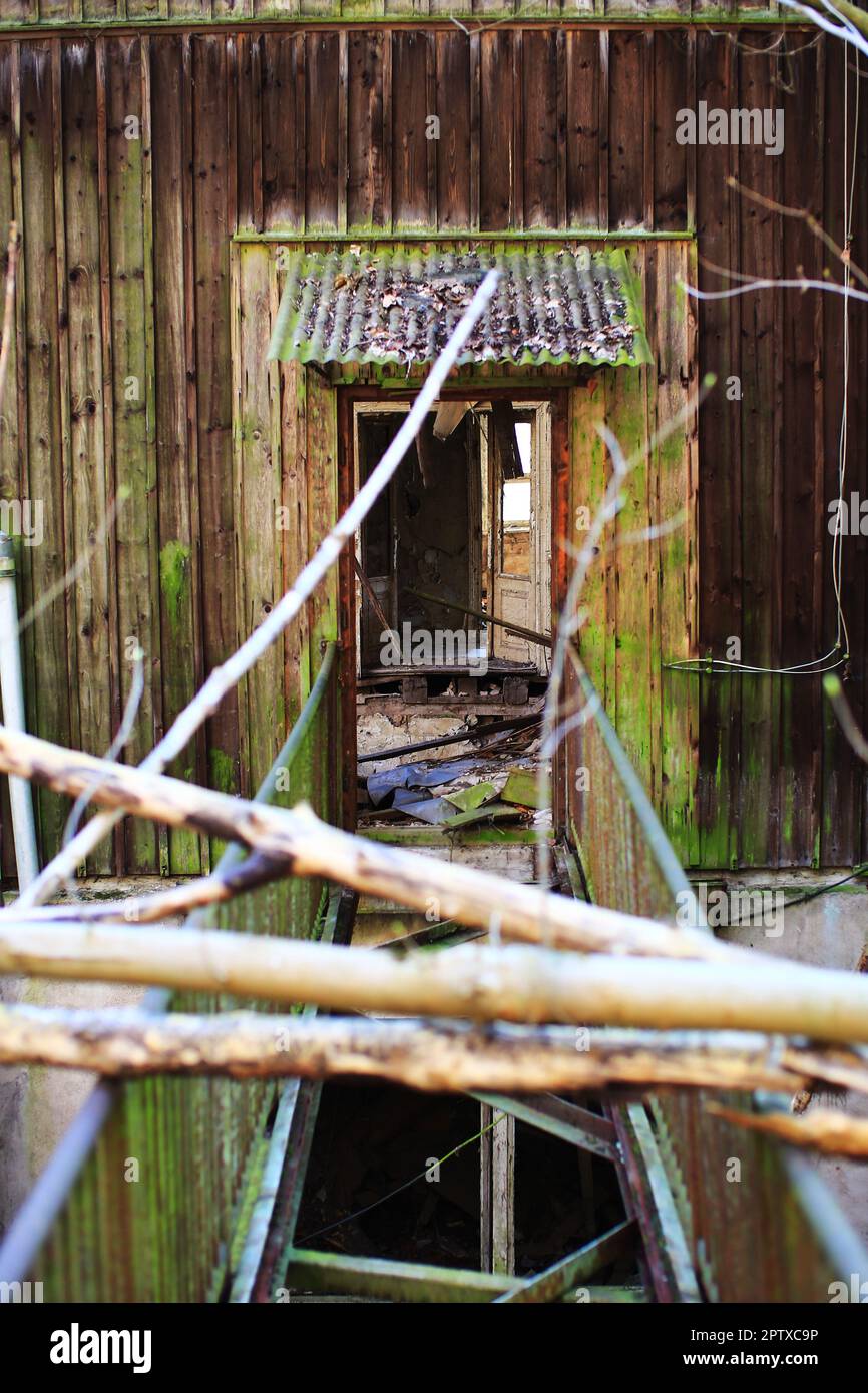 Damaged and blocked bridge leading into an abandoned building Stock ...