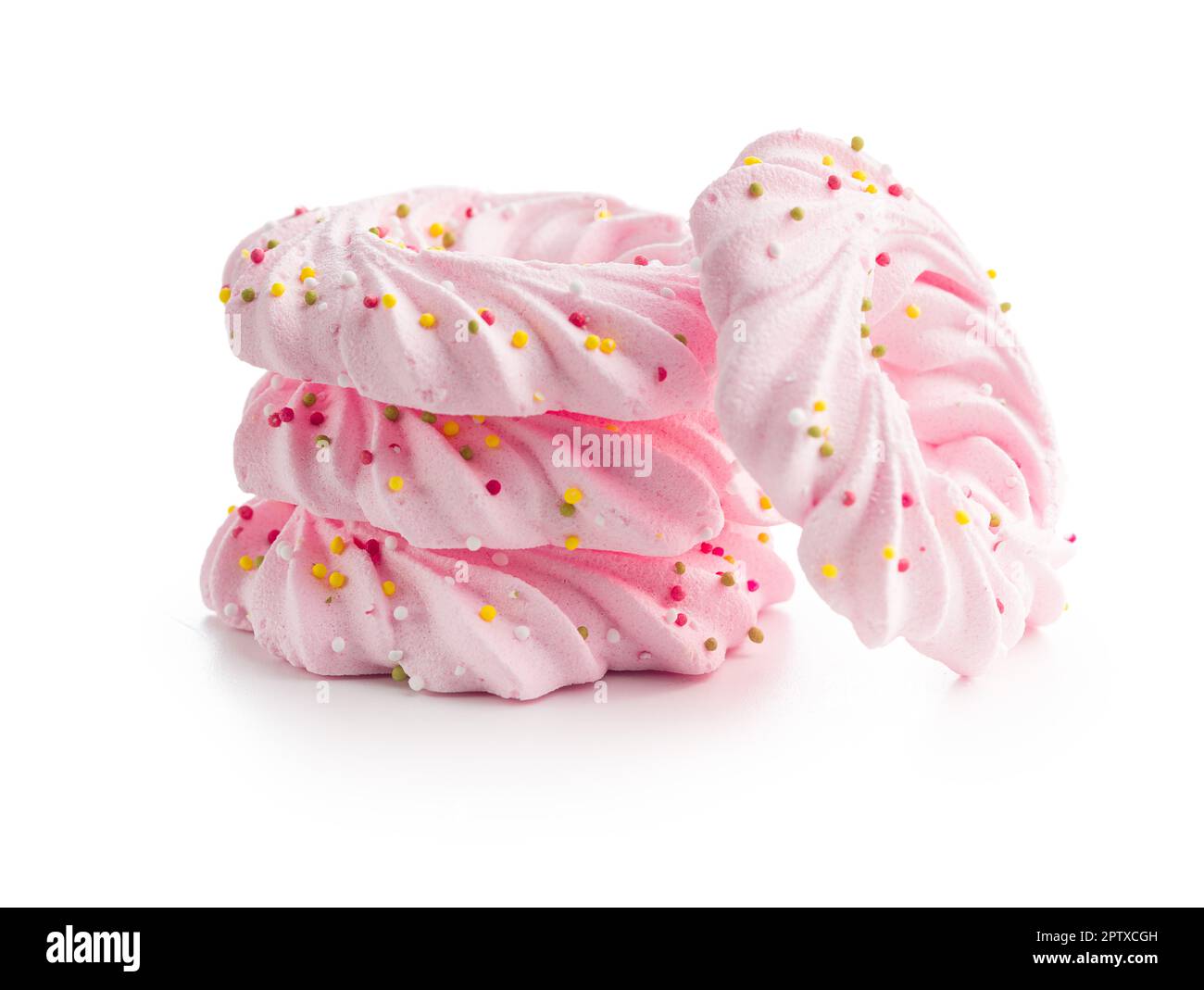 Pink sweet meringues with sprinkles isolated on the white background ...